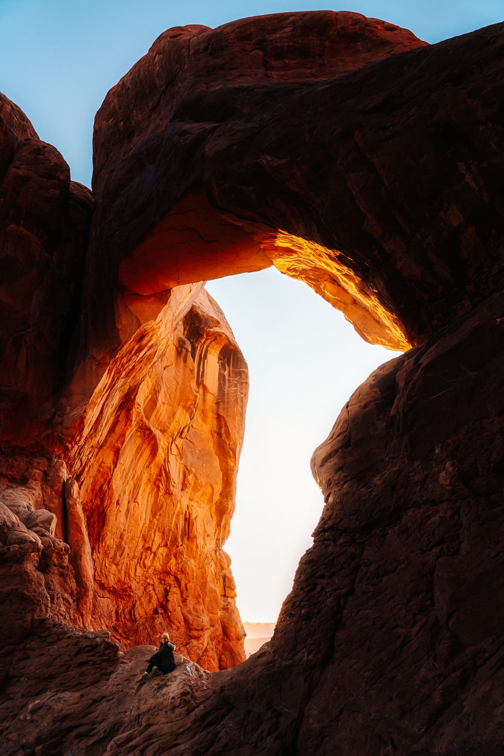 Sunset glow on one of the arches on the Double Arches trail in Arches ...