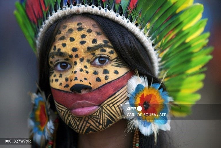 A woman from the Pataxo tribe poses for a photo at an indigenous ...