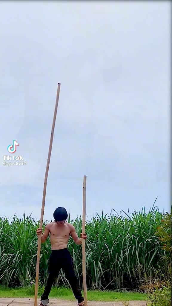 Climbing an unsupported pole using upper body strength and balance