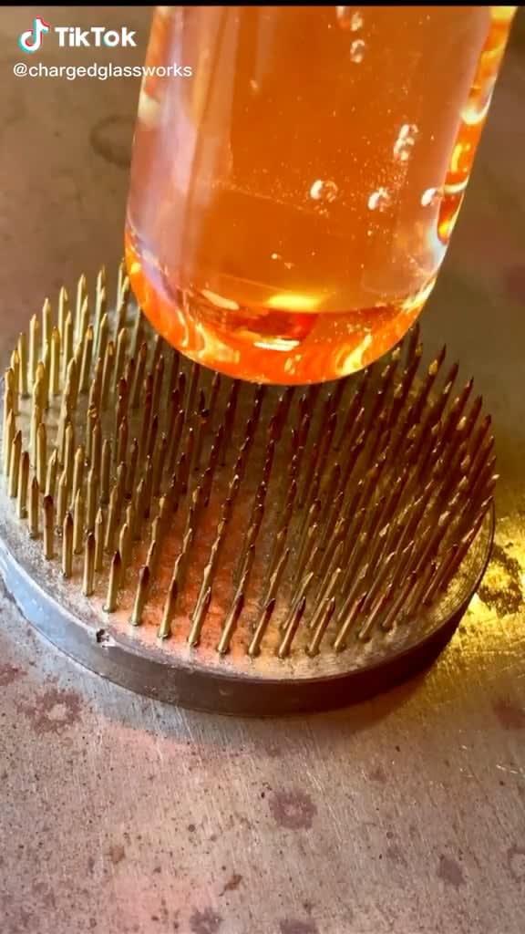 Molten glass pressed into spikes