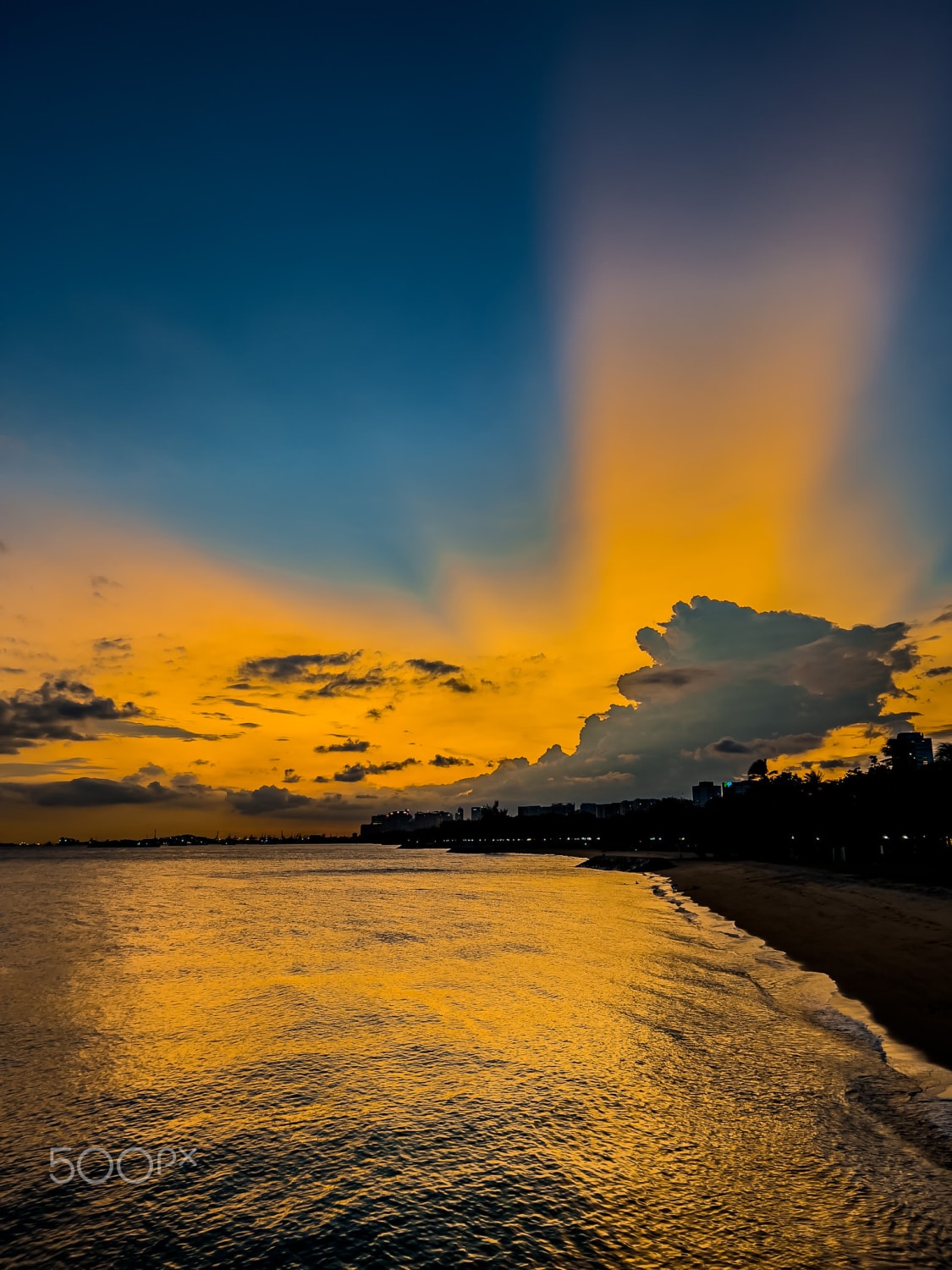 Orange sunset streaks by the beach in East Coast Park