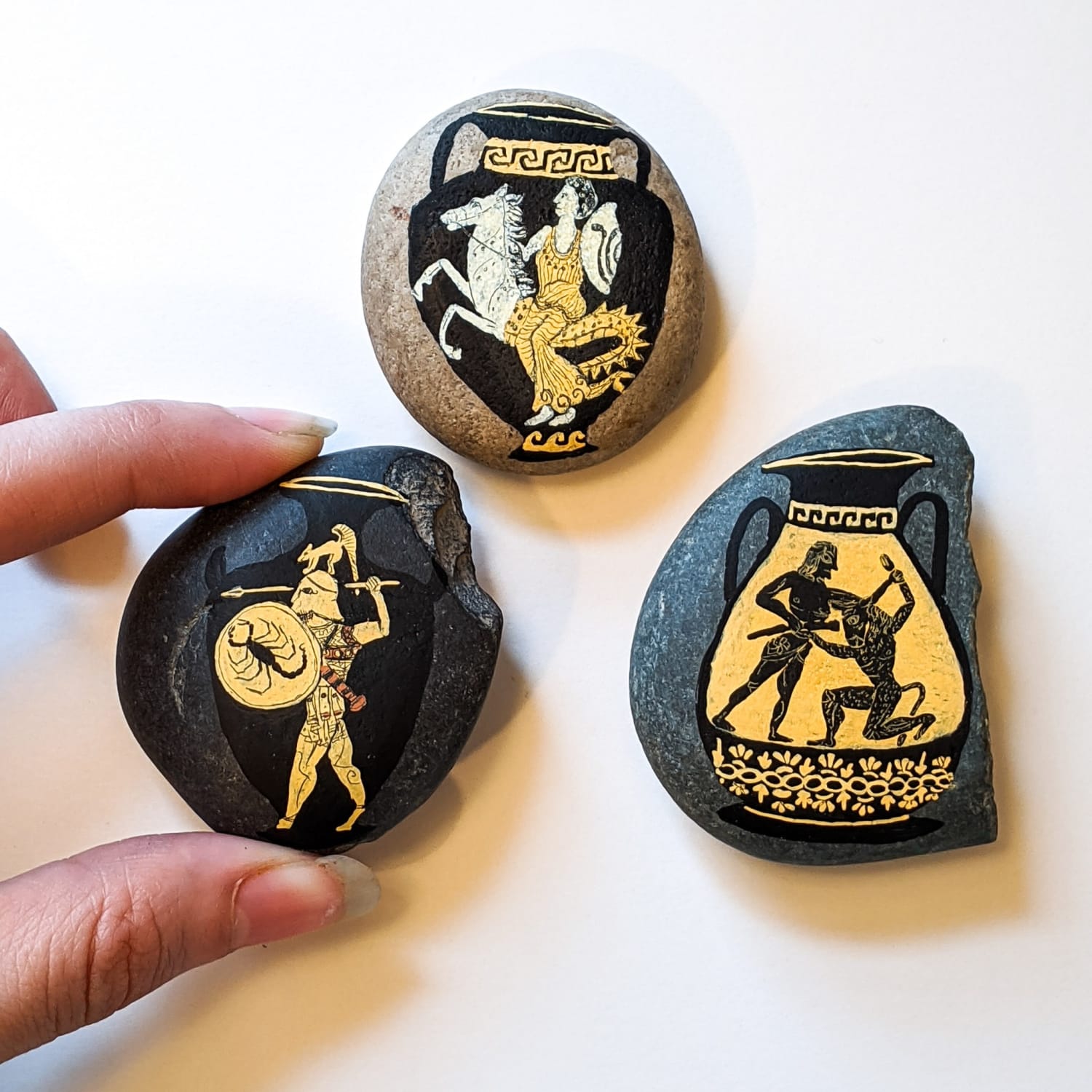 Drawings on rocks, inspired by ancient Greek vases. The biggest is ...