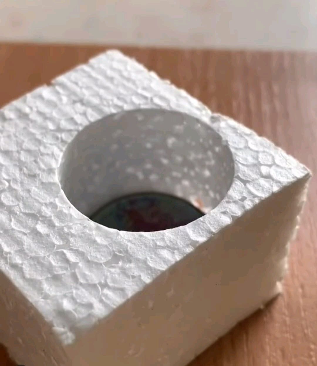 Hot coin burning through styrofoam