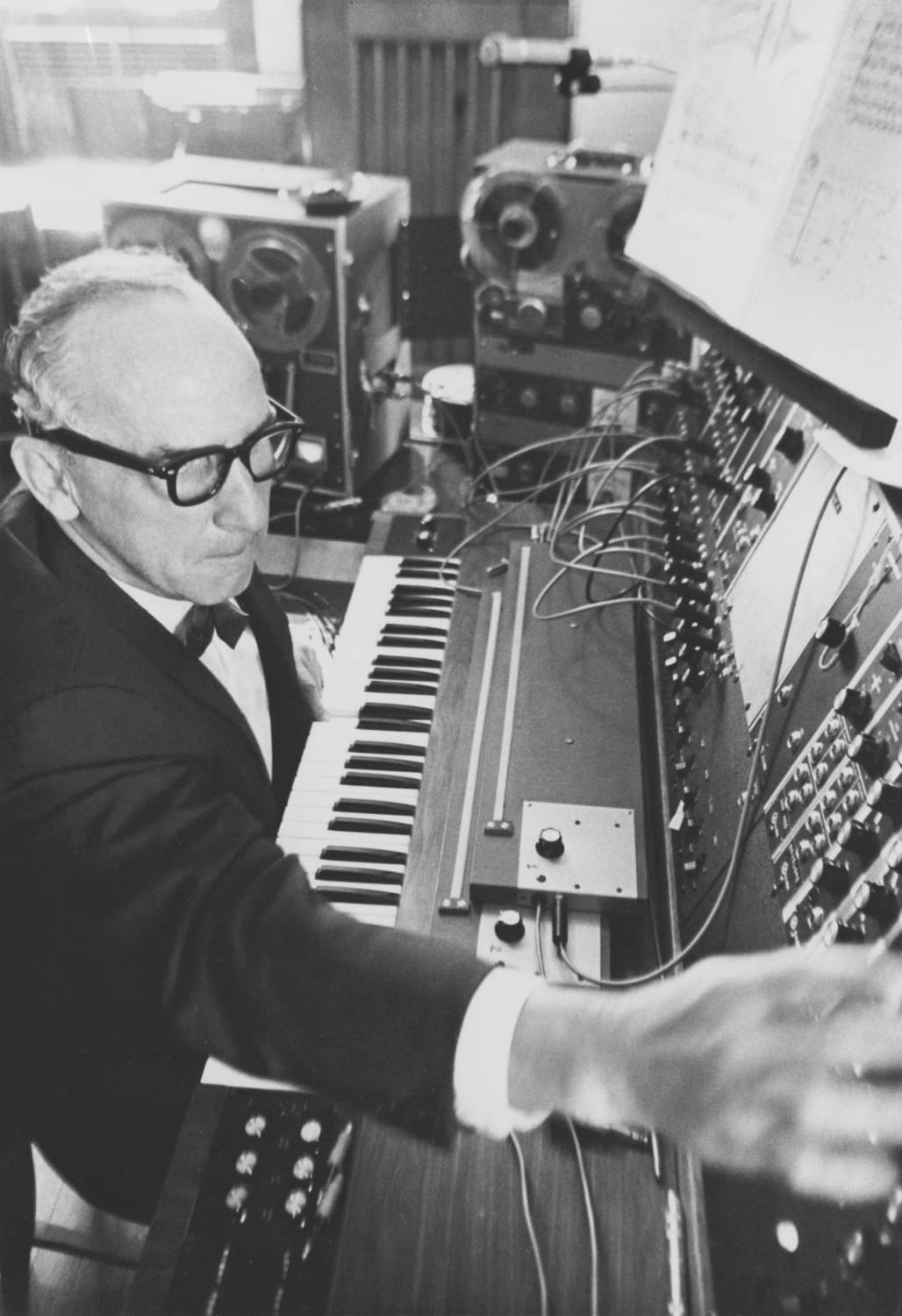 Merrill Ellis sitting at the Moog synthesizer in the North Texas State ...