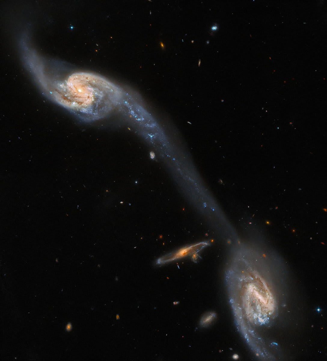 📷This NASA/ESA @HUBBLE_space Telescope image shows two of galaxies in ...