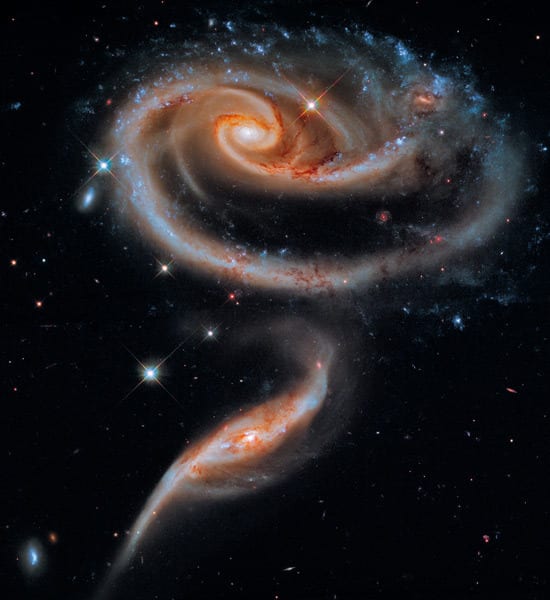 This image of two interacting galaxies, called Arp 273, has been ...