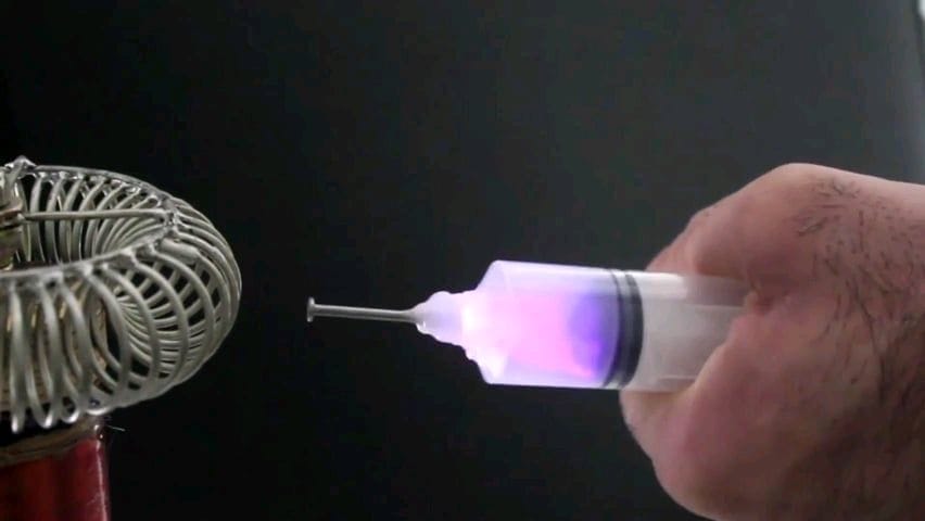 Extracting electricity from a tesla coil using a syringe. OP: u/solateor