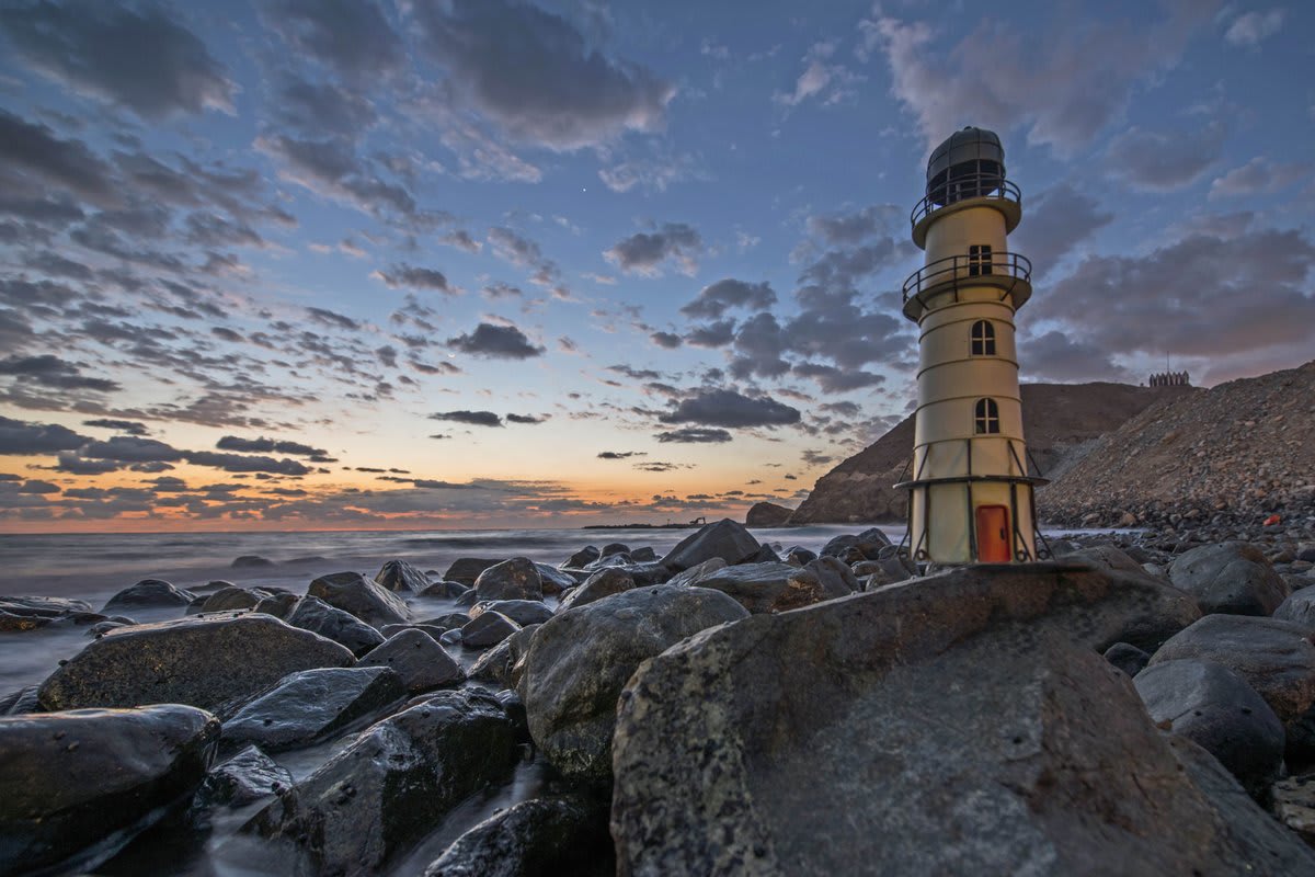 A photographer creates a landscape with a miniature lighthouse in this ...