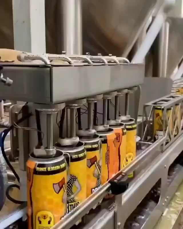 This assembly line for filling and sealing beer cans.