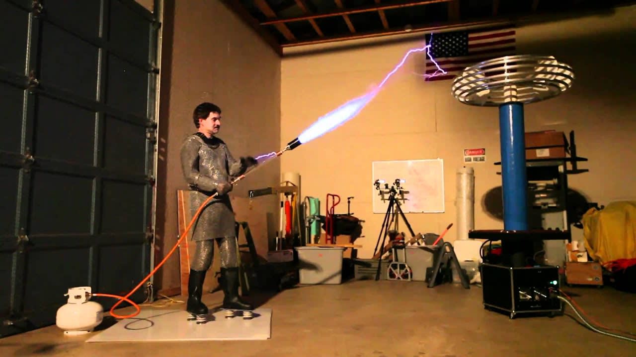 Man with a flamethrower and a tesla coil
