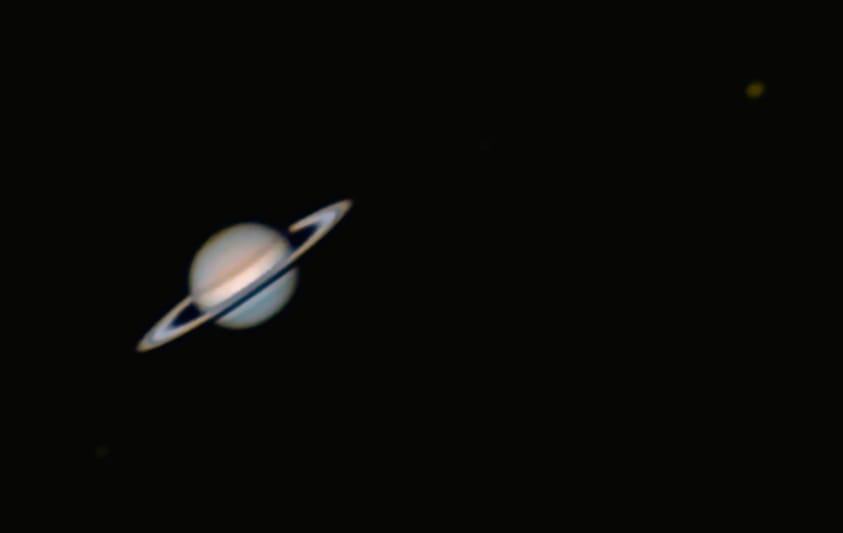 A photo of Saturn and three of its moons I took a few days ago during ...