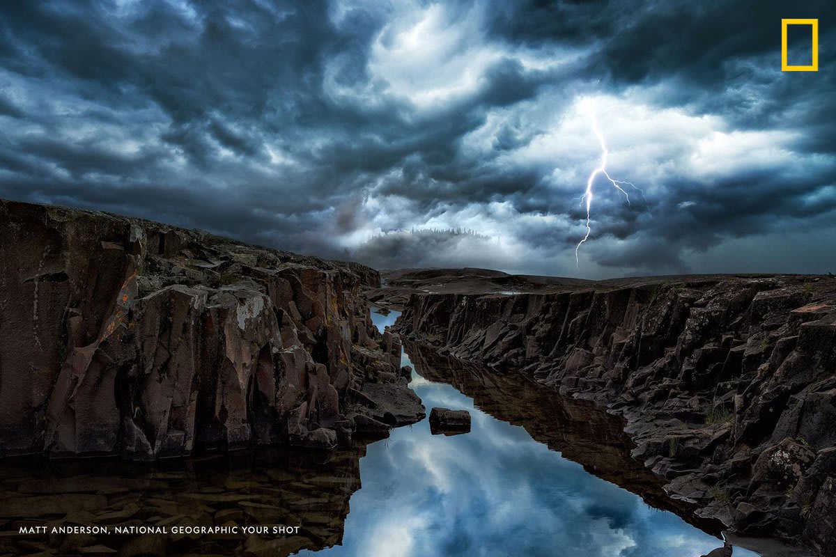 “A thunderstorm with lightning strikes over a Lake Superior coastal ...