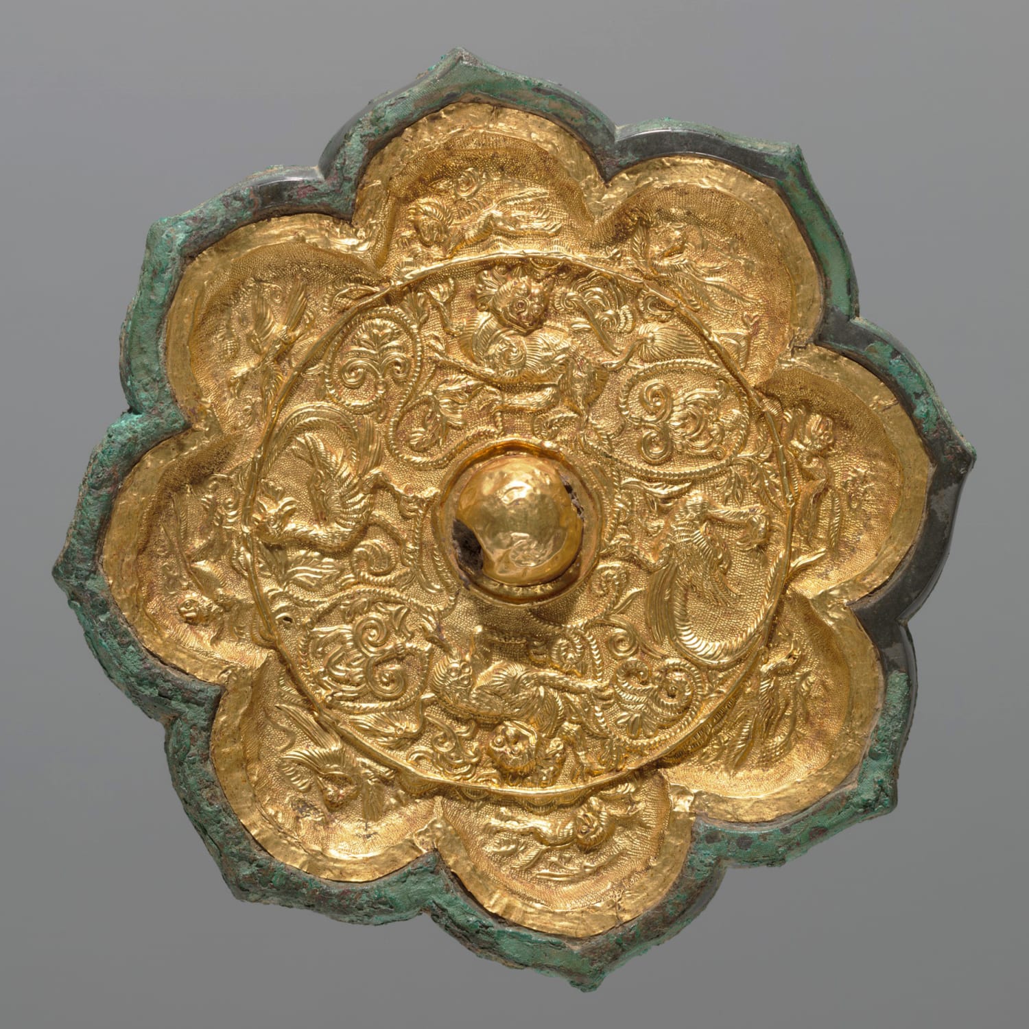 Bronze mirror with decorative gold plate. China, Tang dynasty, 8th century