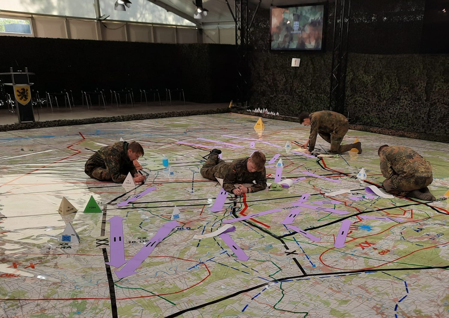 German soldiers prepare a big map for an exercise for troop leaders of ...