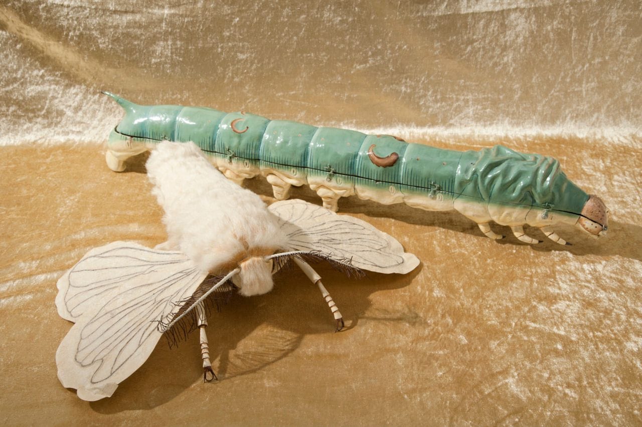 Models of a silkworm moth and caterpillar, created in a special form of ...