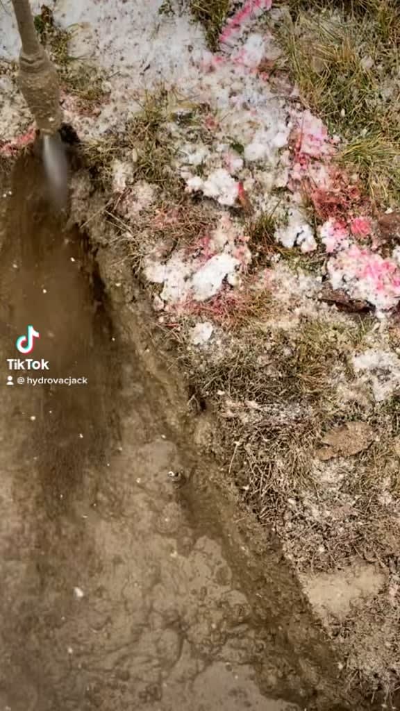 Digging out a GLB (Ground Level Box) for underground fibre conduit.