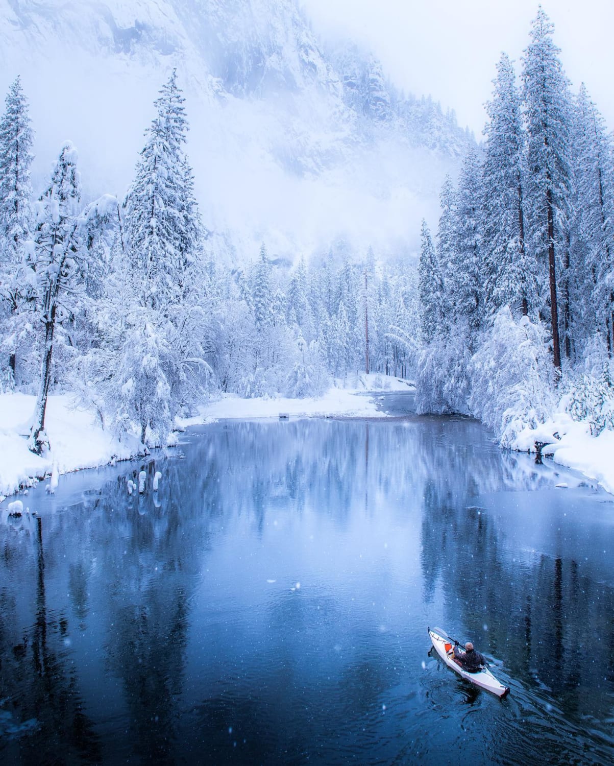 Winter kayaking on the Merced River flowing through Yosemite Valley ...