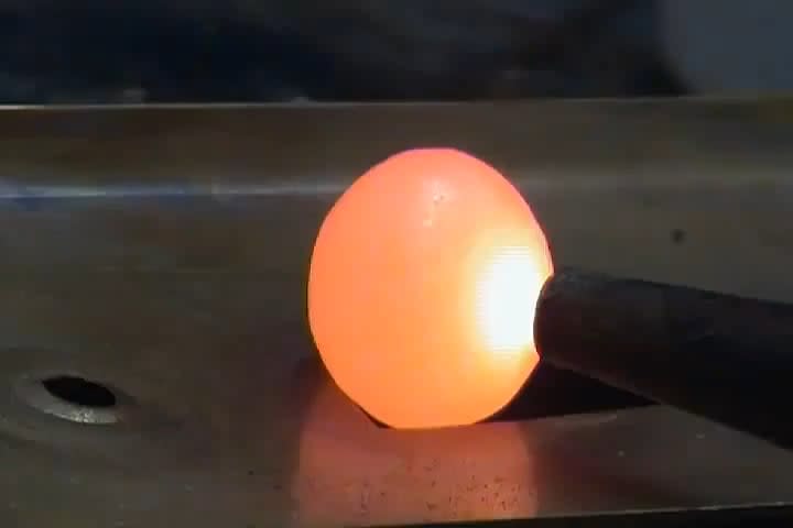 The sound that this red-hot ball of nickel makes when dropped into water