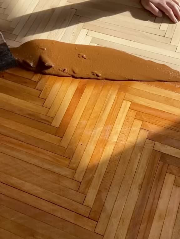Staining and filling a wooden floor