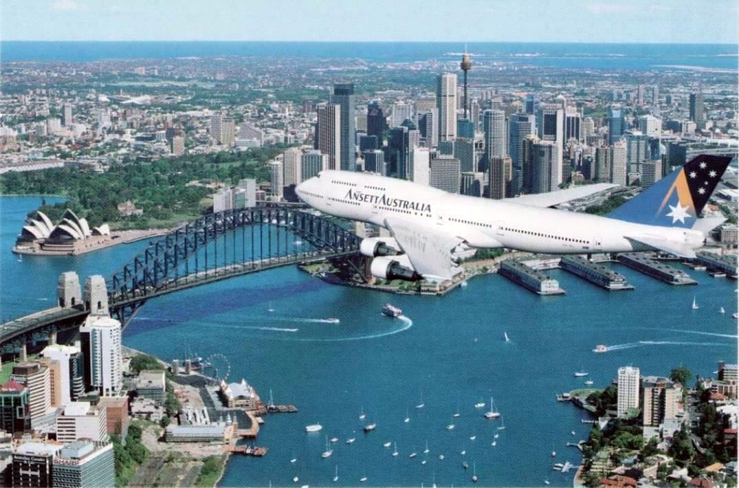 Ansett Australia 747-300 flying over Sydney Harbor - Postcard