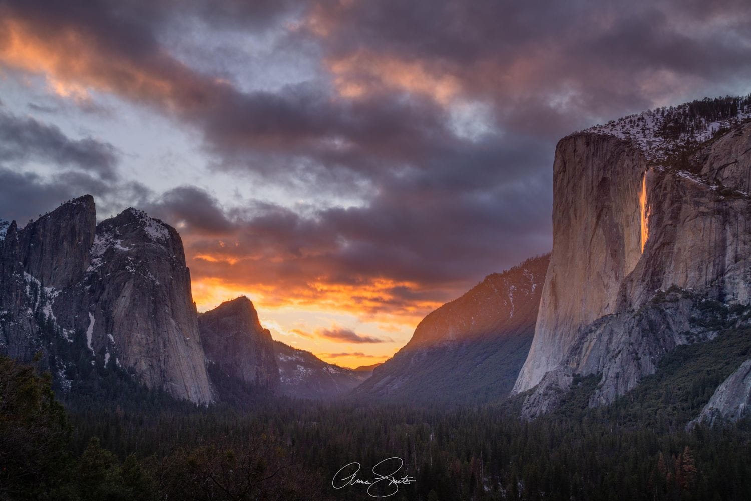 Sun setting the clouds and Horsetail Fall ablaze in Yosemite Valley on ...