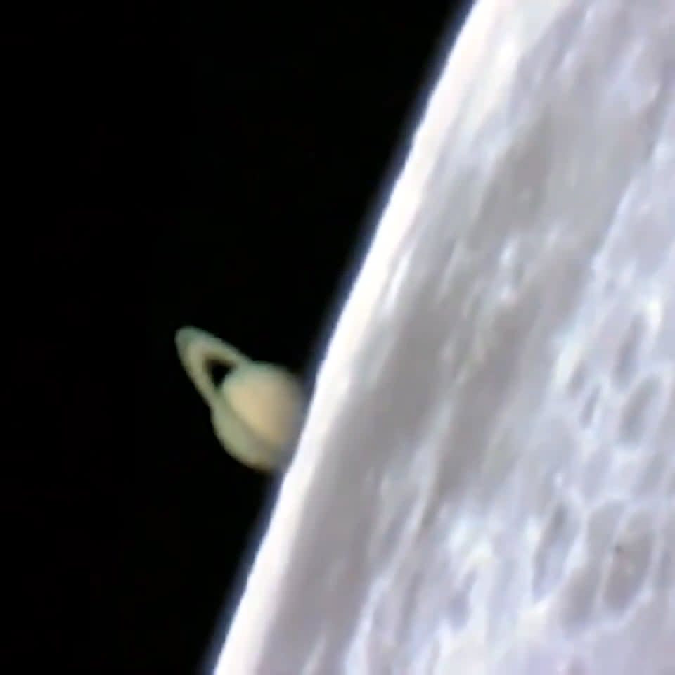 Saturn rising from behind the Moon during a lunar occultation. Captured ...