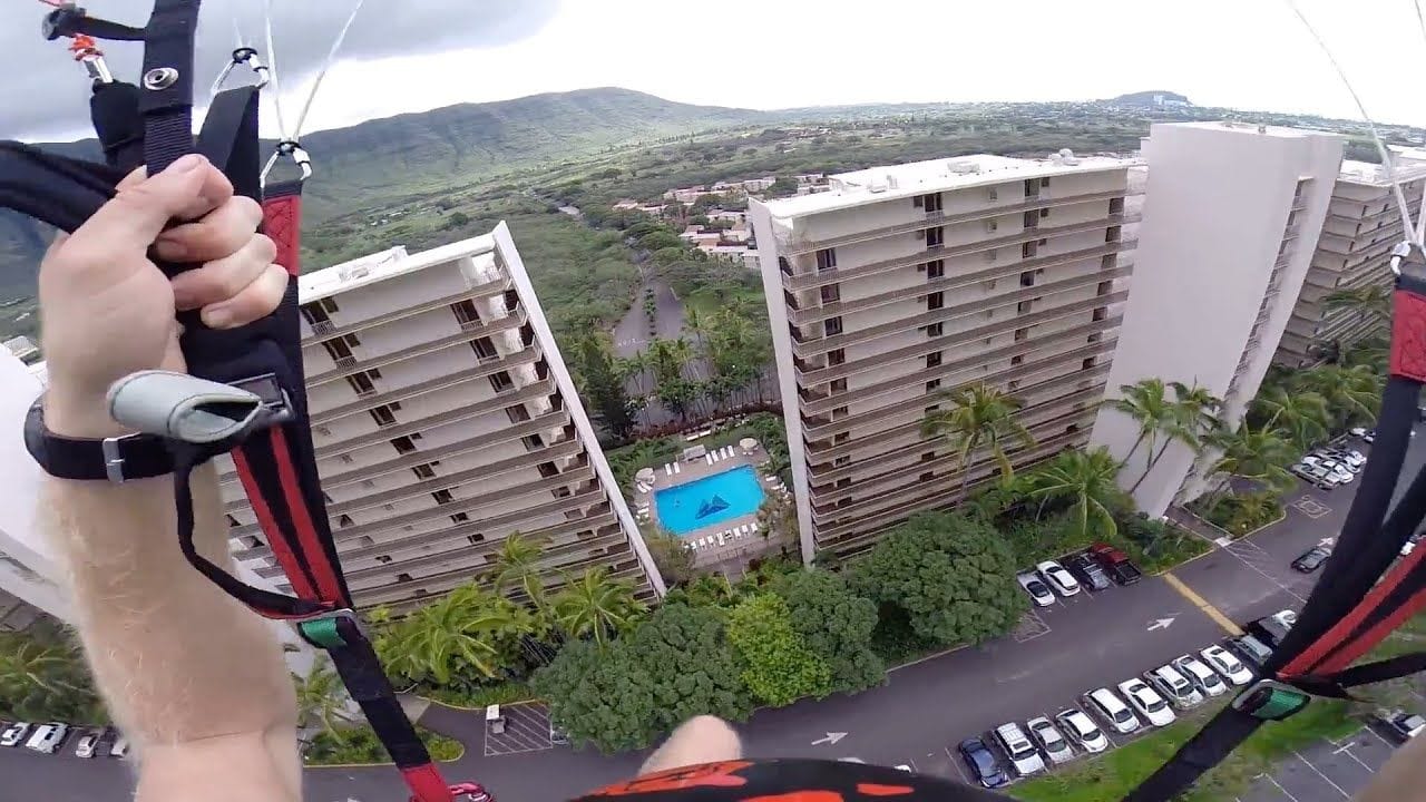 Paragliding through a tiny gap between two buildings!! (People are Awesome)