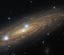 This NASA/ESA @HUBBLE_space Telescope image is an edge-on view of ...